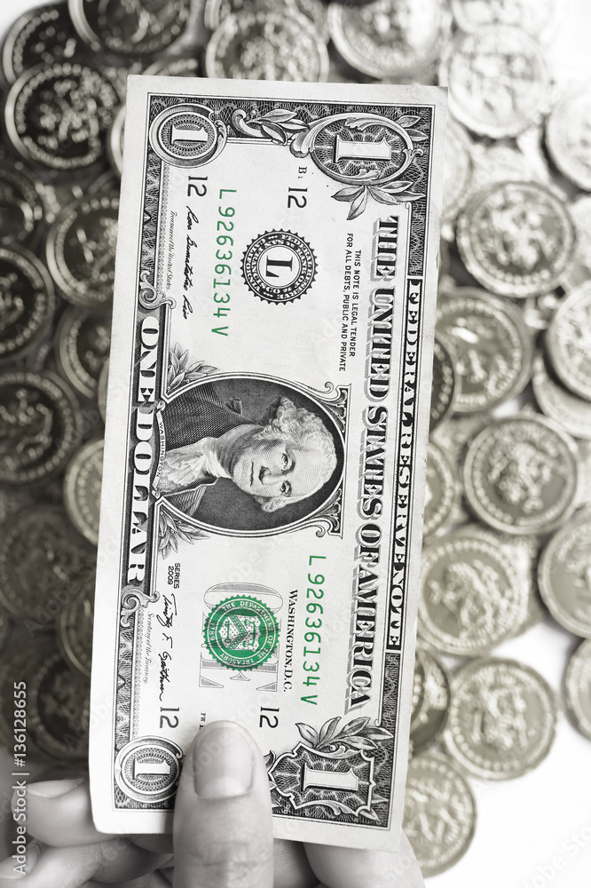 One dolla and gold coins for background take with selective color ...