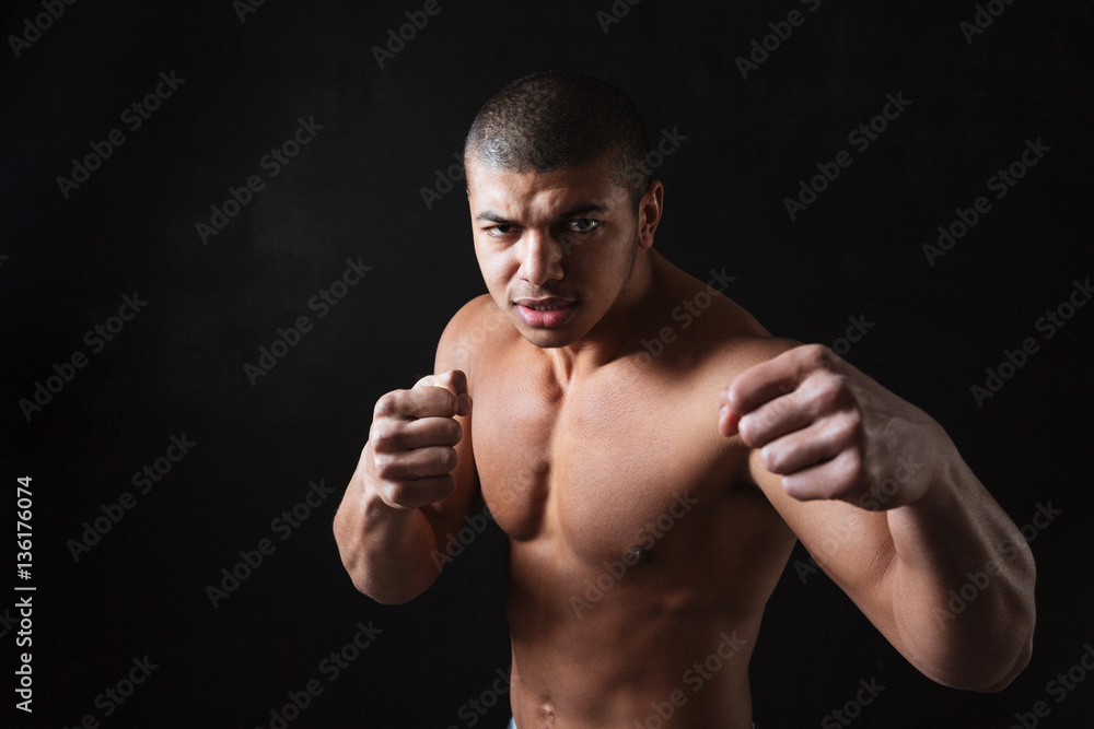 Foto de Agressive shirtless african american man athlete standing and ...