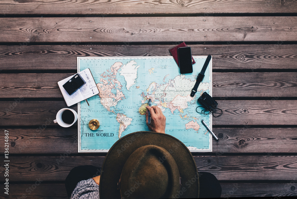 Tourist Planning vacation using world map. Stock Photo | Adobe Stock