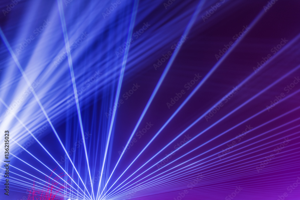 Laser beams in the night sky Stock Photo | Adobe Stock