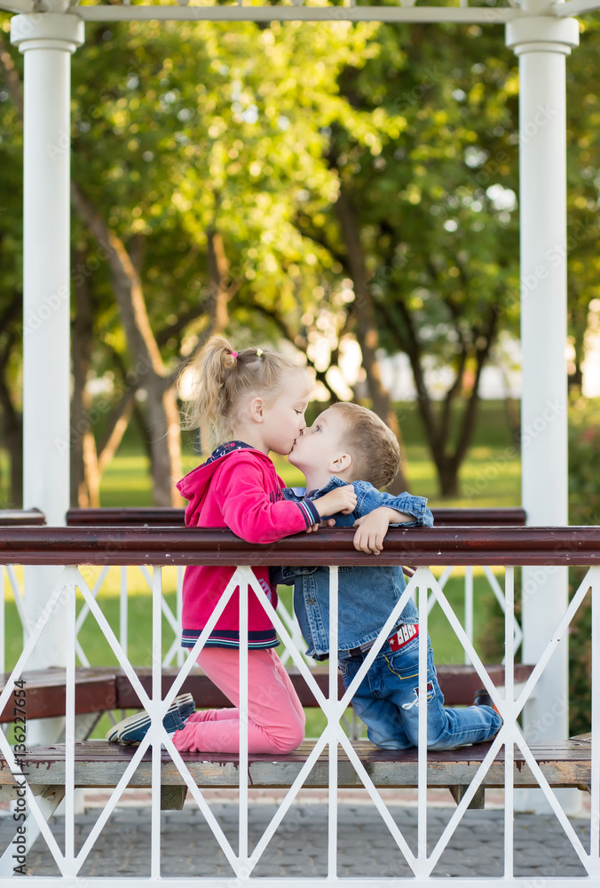 Love concept. Couple of kids loving each other hugging and kissing ...