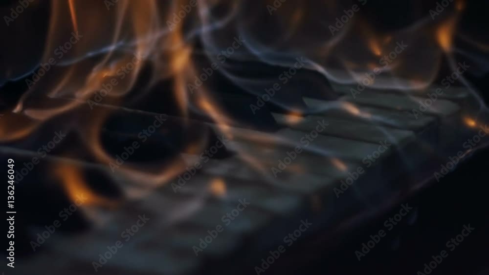 The fire is burning keys of a piano Stock Video | Adobe Stock