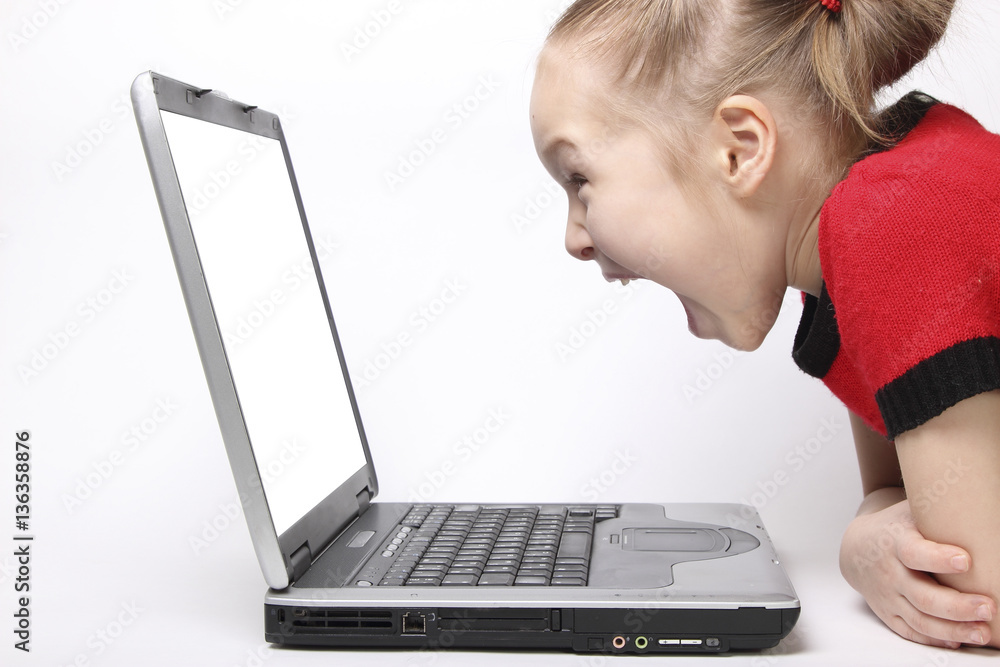 girl watching and laughing in front of the laptop screen. isolated ...