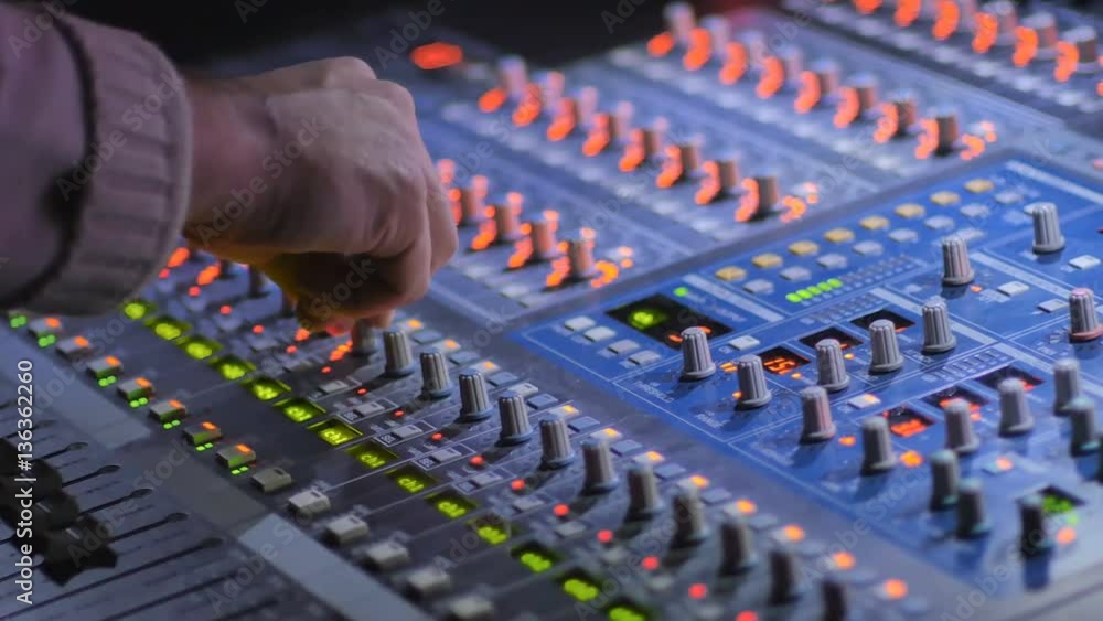 Close-up - the man adjust the DJ mixer Stock Video | Adobe Stock