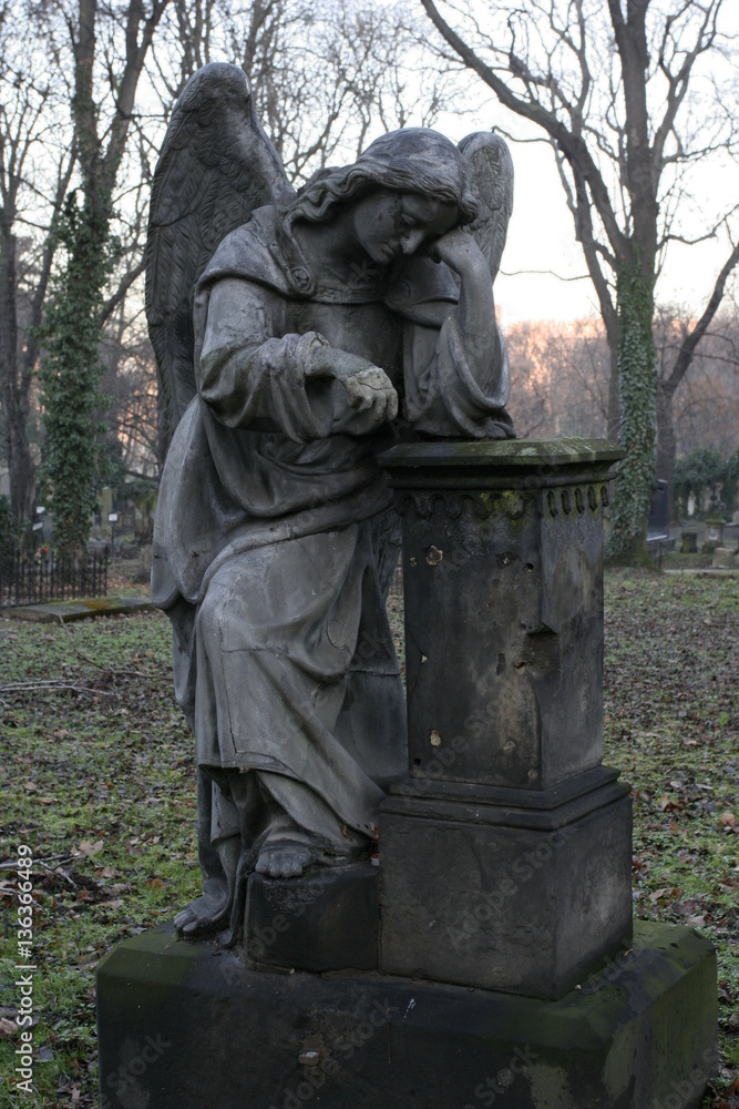 The old stony tombstone with the sculpture of the angel in Olsany ...