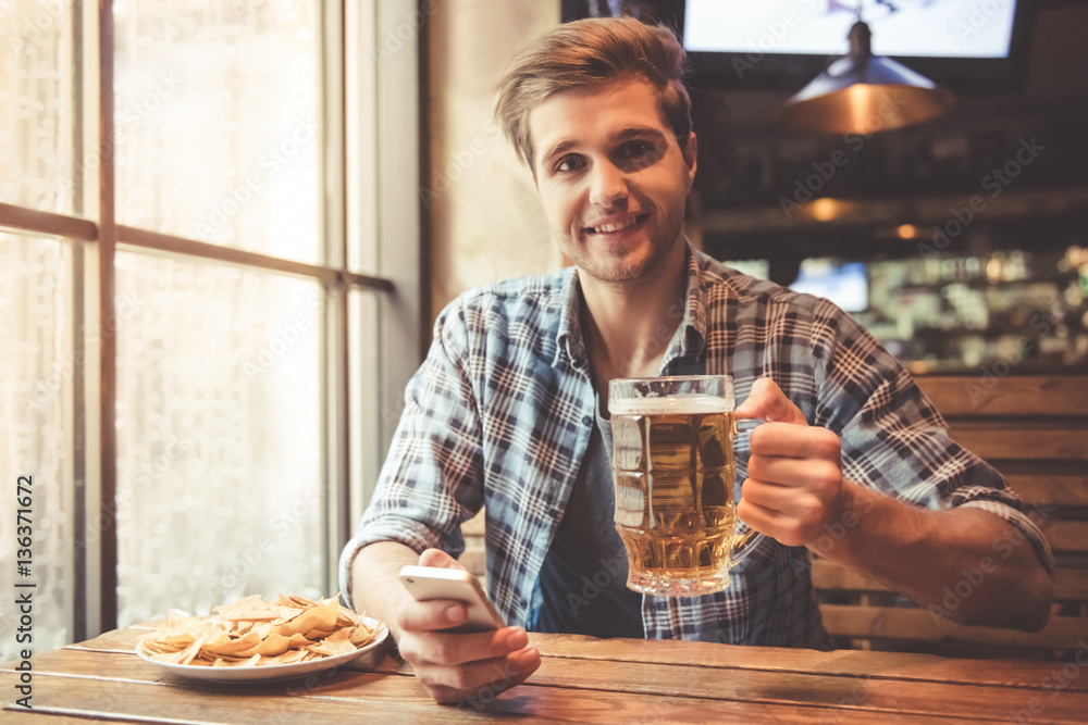 Man at the pub Stock Photo | Adobe Stock