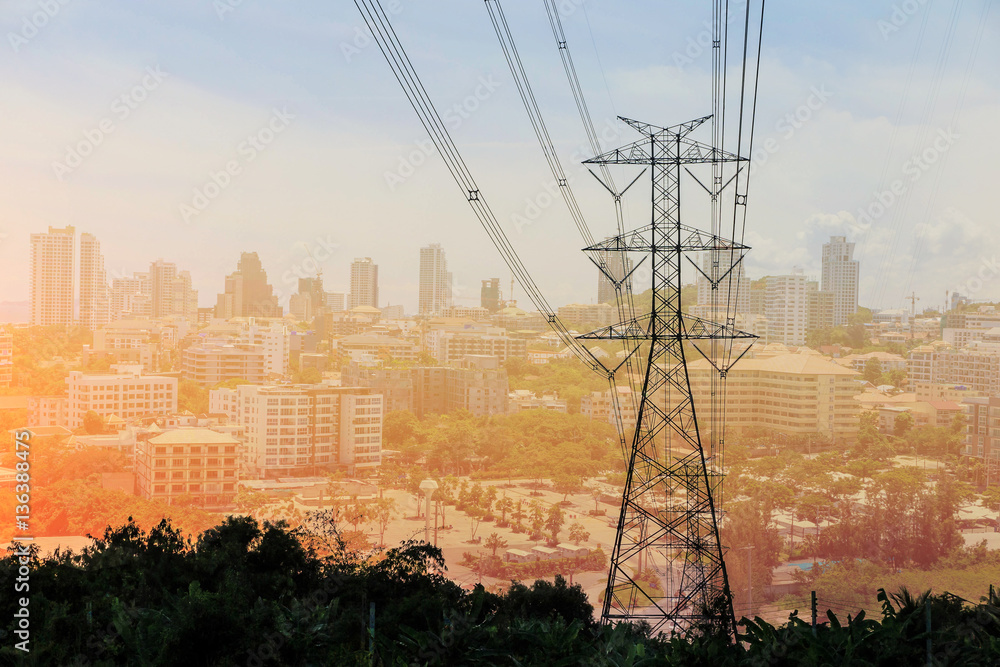 Electricity tower and electric line, power line and city building ...