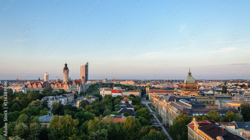 panoramic skyline of Leipzig with townhall and high court at sunset ...