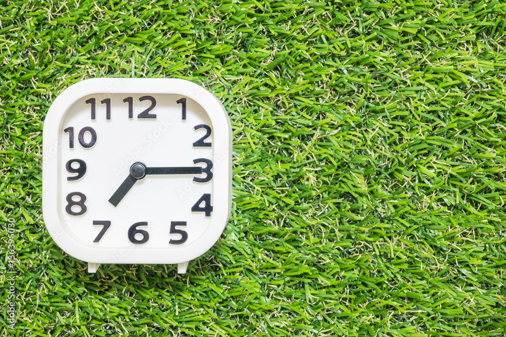 Closeup white clock for decorate show a quarter past seven or 7:15 a.m ...