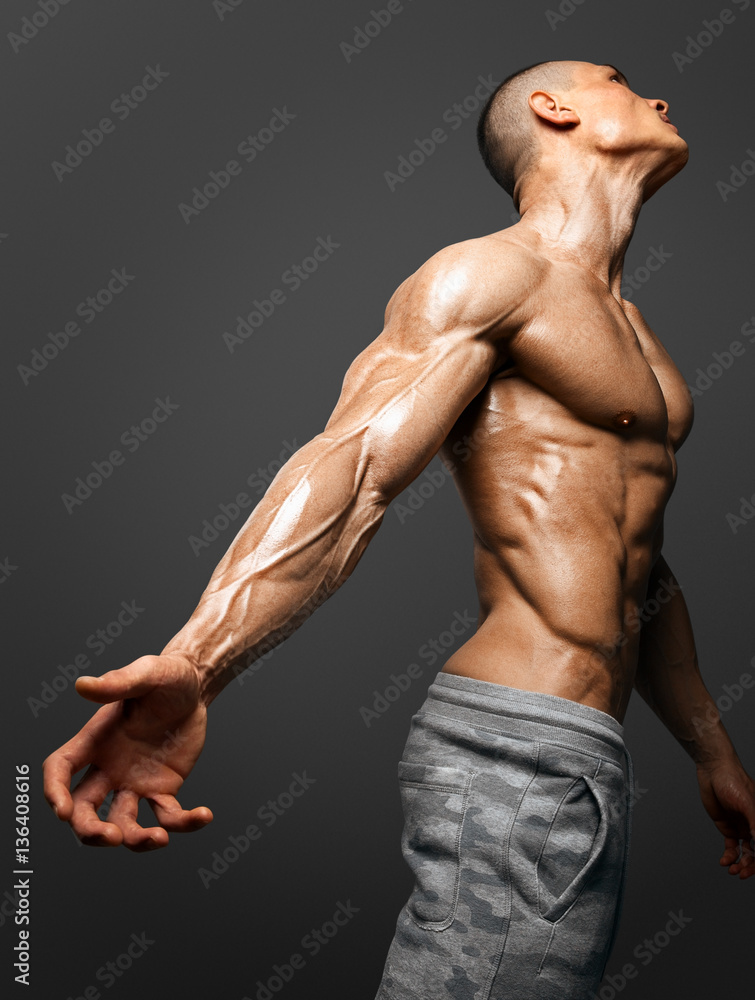 Strong Athletic Man Fitness Model Stock Photo | Adobe Stock