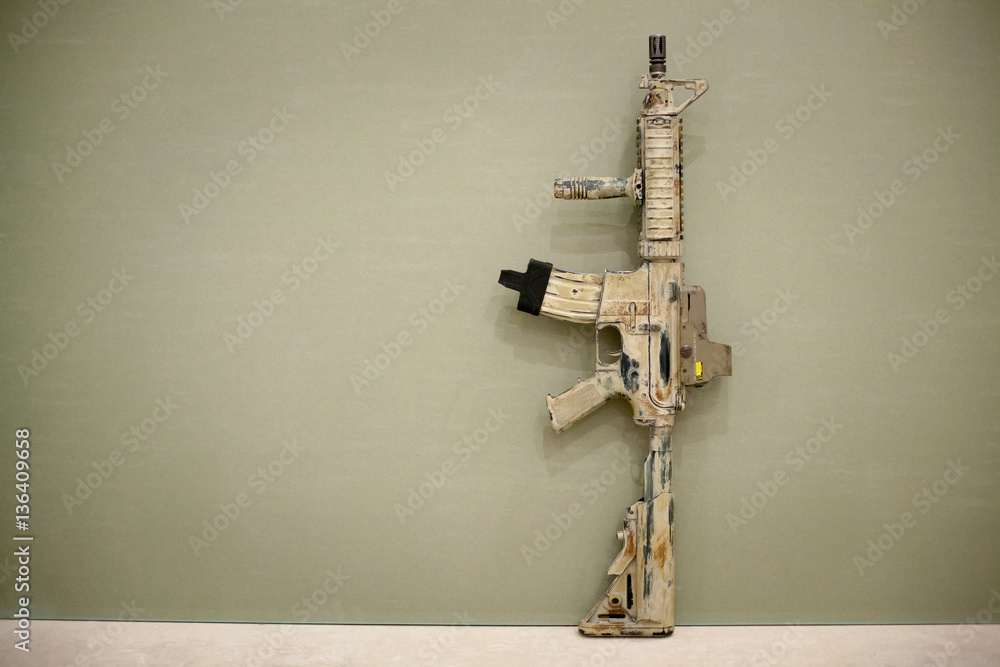 Assault Rifle, painted in sand color. Stock Photo | Adobe Stock