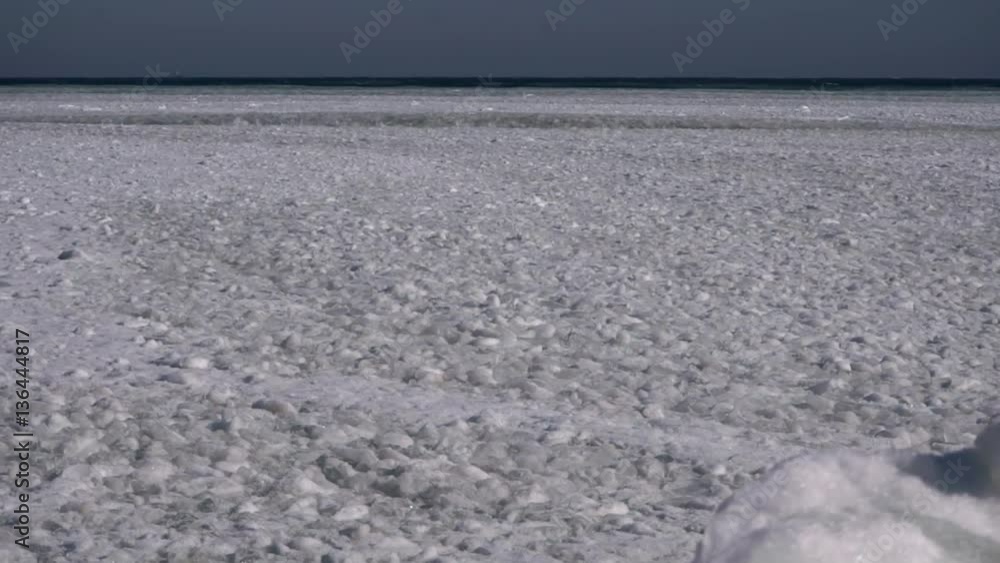 Frozen sea coast: during Bright sunny day Stock Video | Adobe Stock