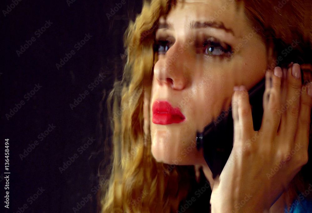 Woman crying by phone. Girl talking on phone . Portrait of sad female ...
