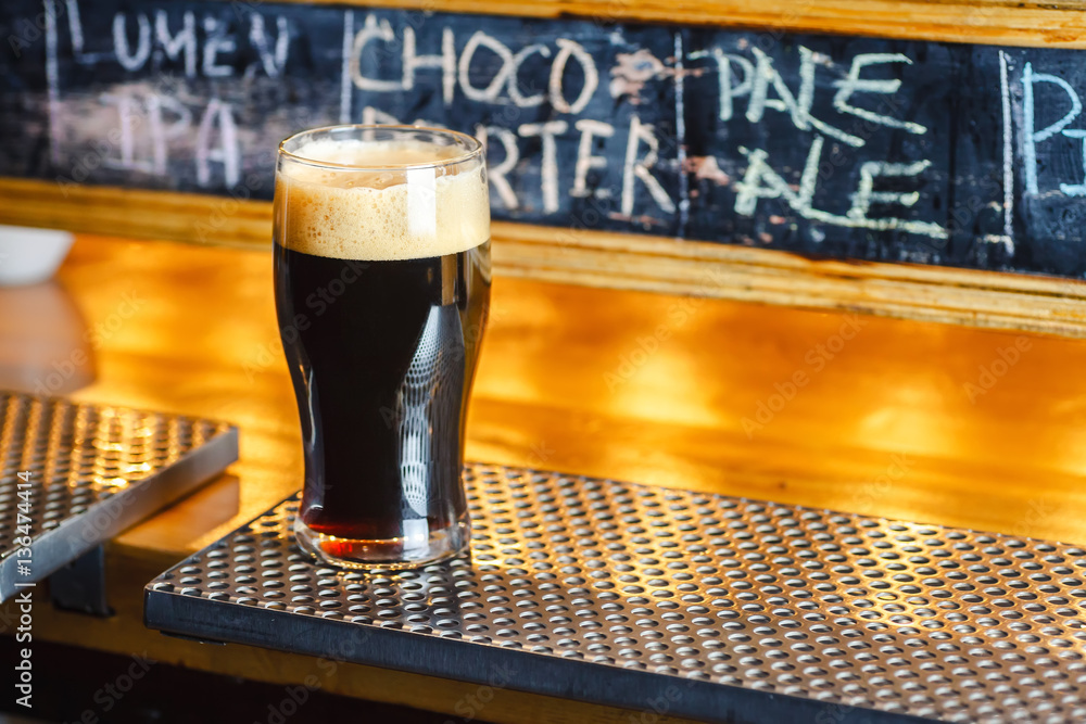 Stout ale on a bar counter Stock Photo | Adobe Stock