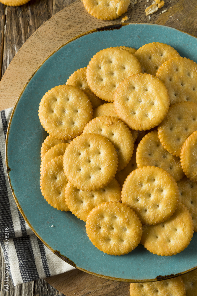 Round Salty Yellow Crackers Stock Photo | Adobe Stock