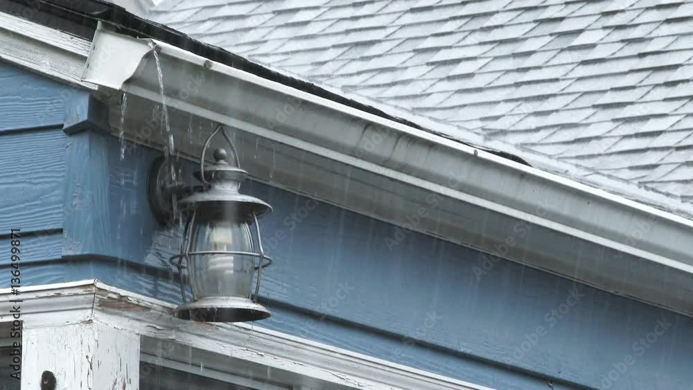 Heavy rain causes gutters to back up and overflow during rain storm in ...