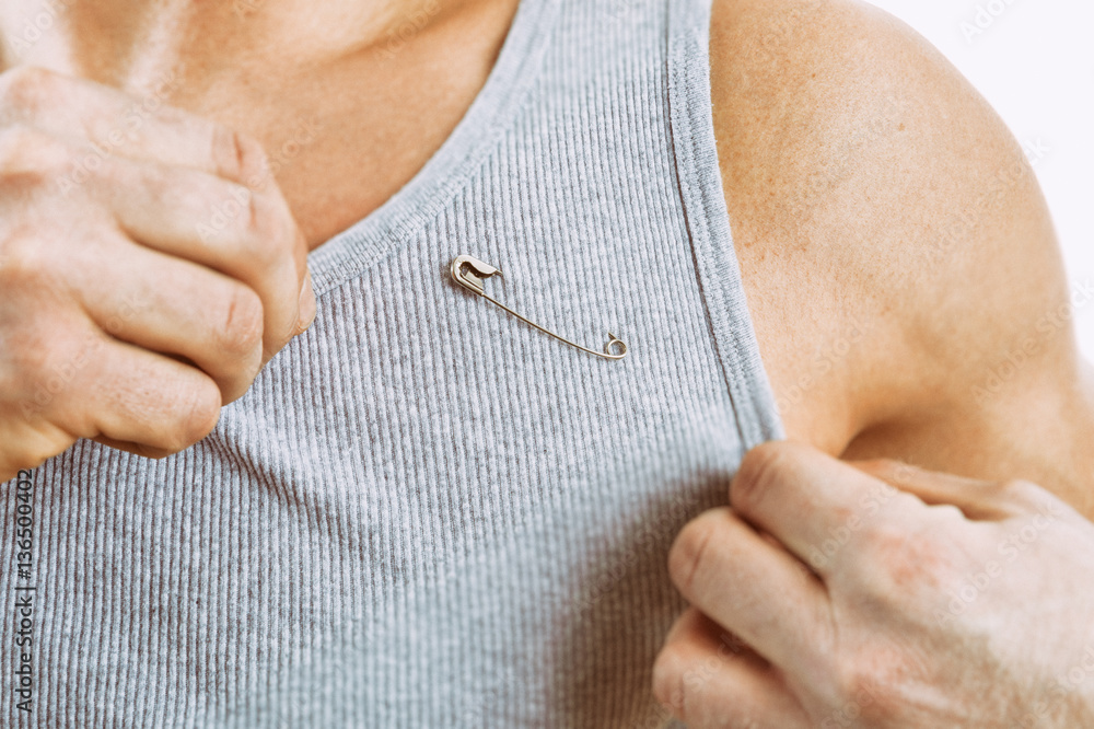 Man wearing a safety pin as a symbol of solidarity Stock Photo | Adobe ...