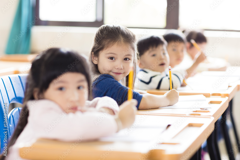 happy little girl student in the classroom Stock Photo | Adobe Stock