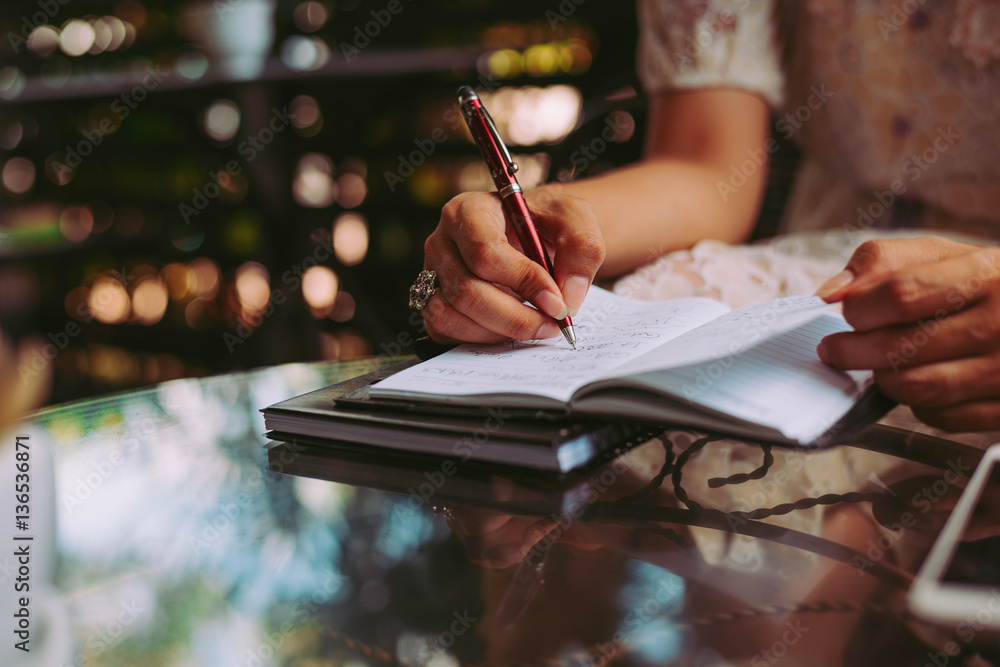 home office desk background,hand holding pencil and writing note on ...