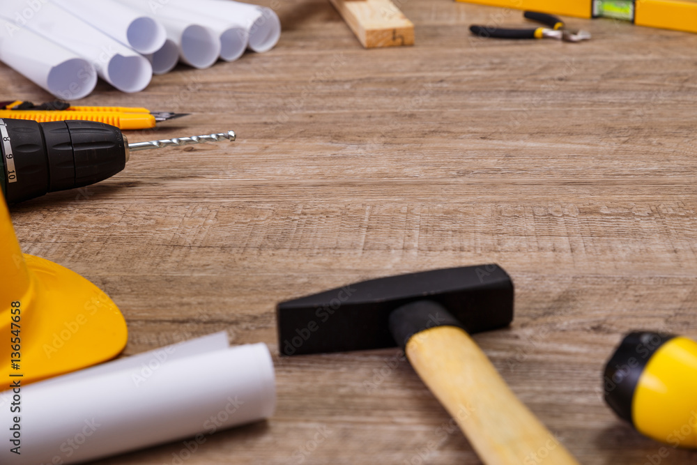 Hammer, helmet and building level. Wooden planks and drill ...