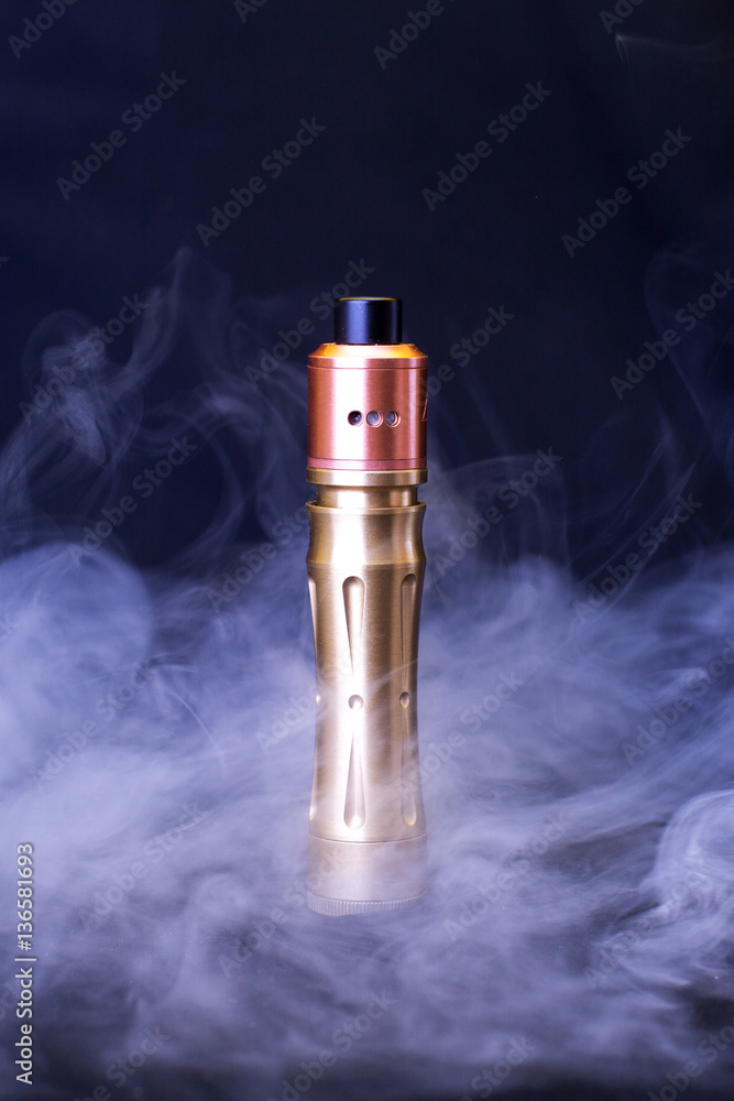 Electronic cigarette over a dark background. E-cigarette for vaping ...