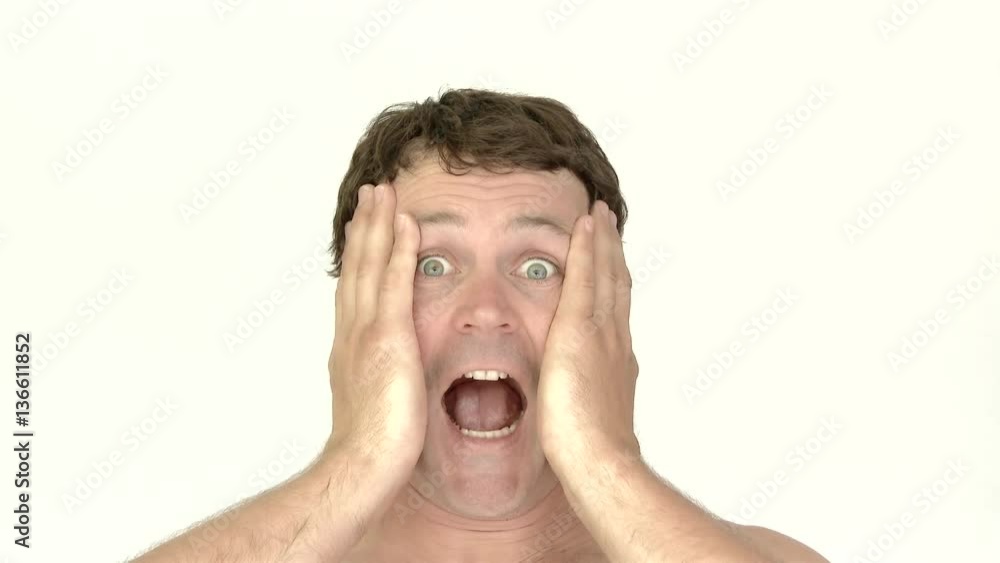 Model released man in studio with hands on his face screaming. Captured ...