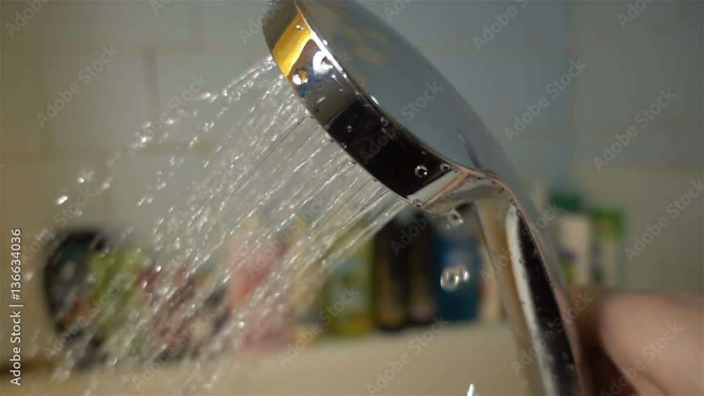 A close-up of a shower head turning on HD Stock Video | Adobe Stock