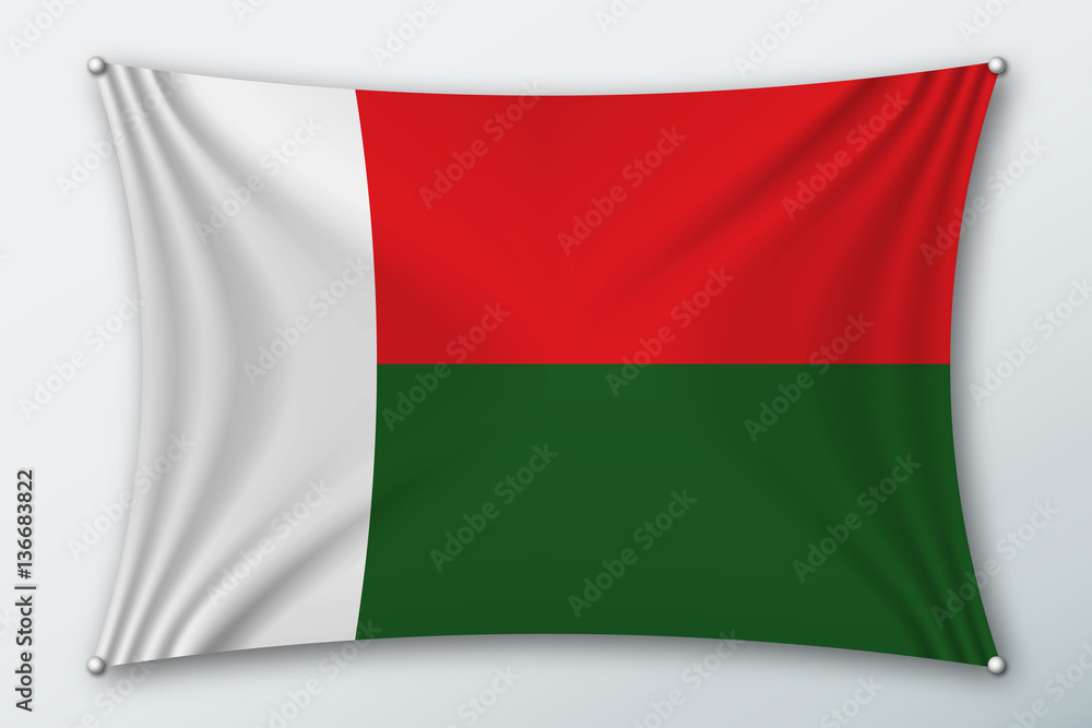Madagascar national flag. Symbol of the country on a stretched fabric ...