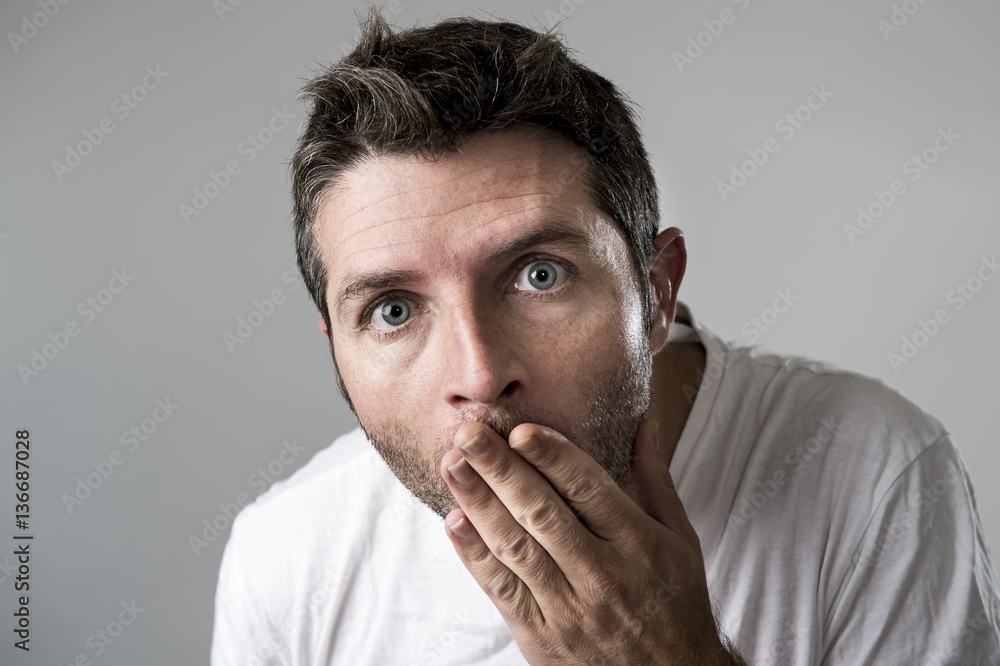 young attractive man astonished amazed in shock surprise face ...