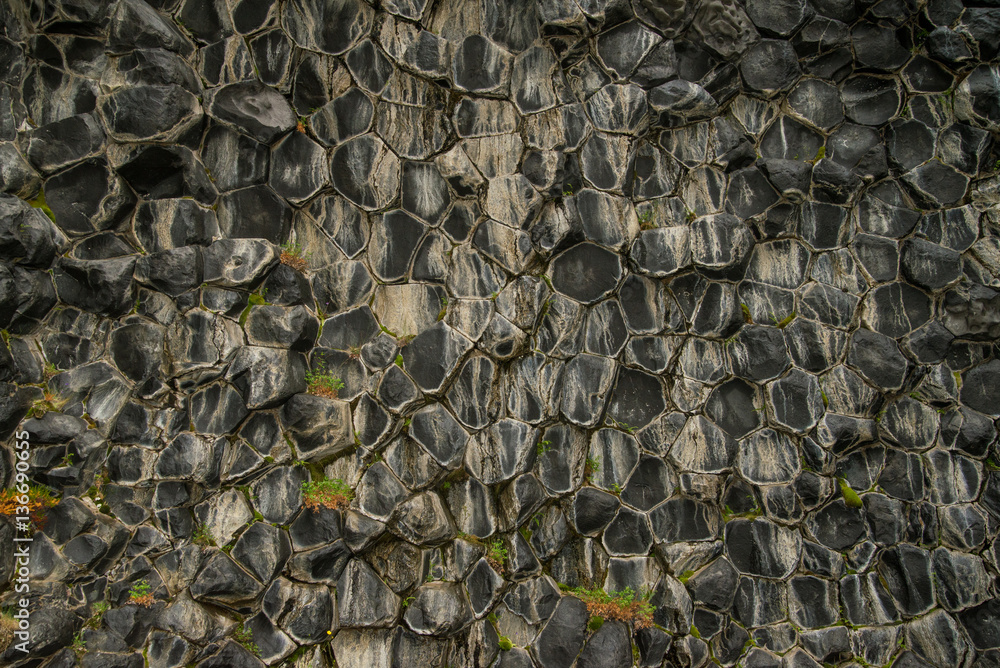 Tubular hexagonal volcanic rock Stock Photo | Adobe Stock