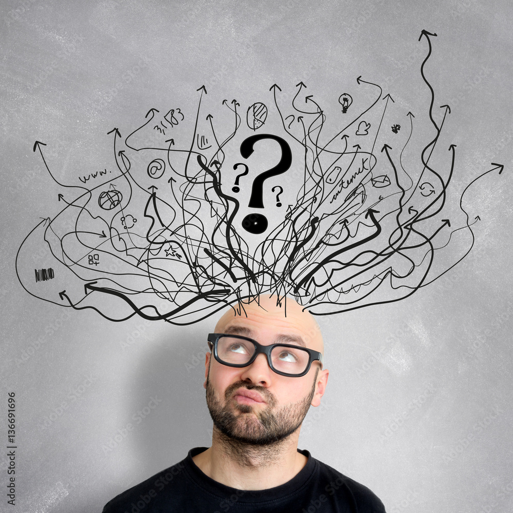 Young attractive perplexed geek man with brainstormaing arrow ov foto ...