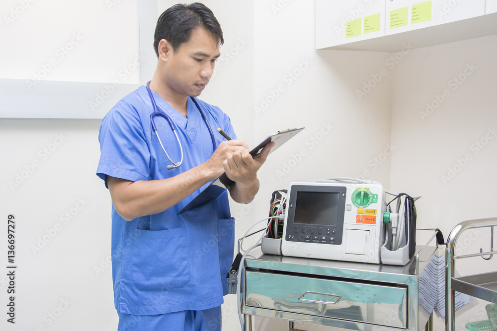 doctor check EKG monitor in emergency room at hospital Stock Photo ...