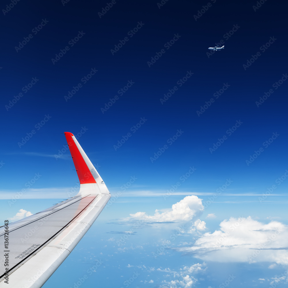 Oncoming flight traffic in mid air. Aircraft flying above beautiful ...