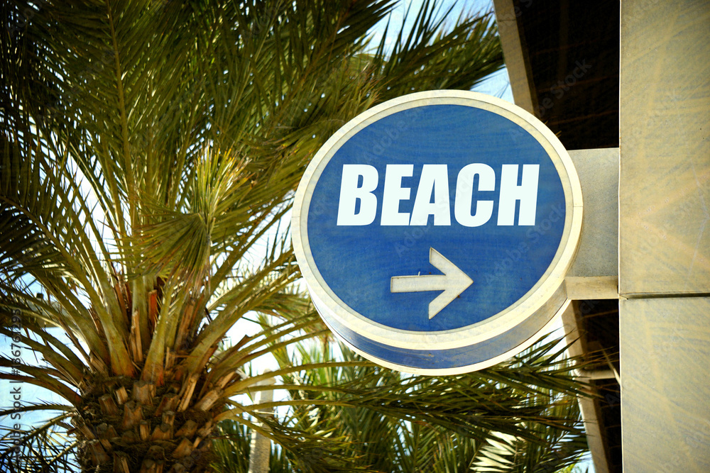 aged and worn vintage photo of beach sign with palm trees Stock Photo ...