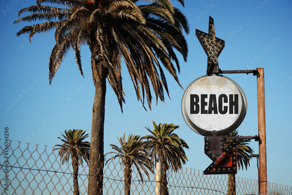 aged and worn vintage photo of beach sign with palm trees Stock Photo ...