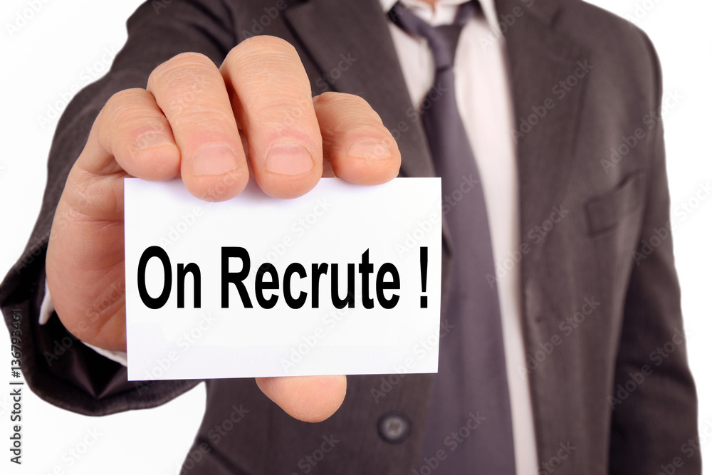 Homme tenant une carte avec on recrute écrit dessus Stock Photo | Adobe ...