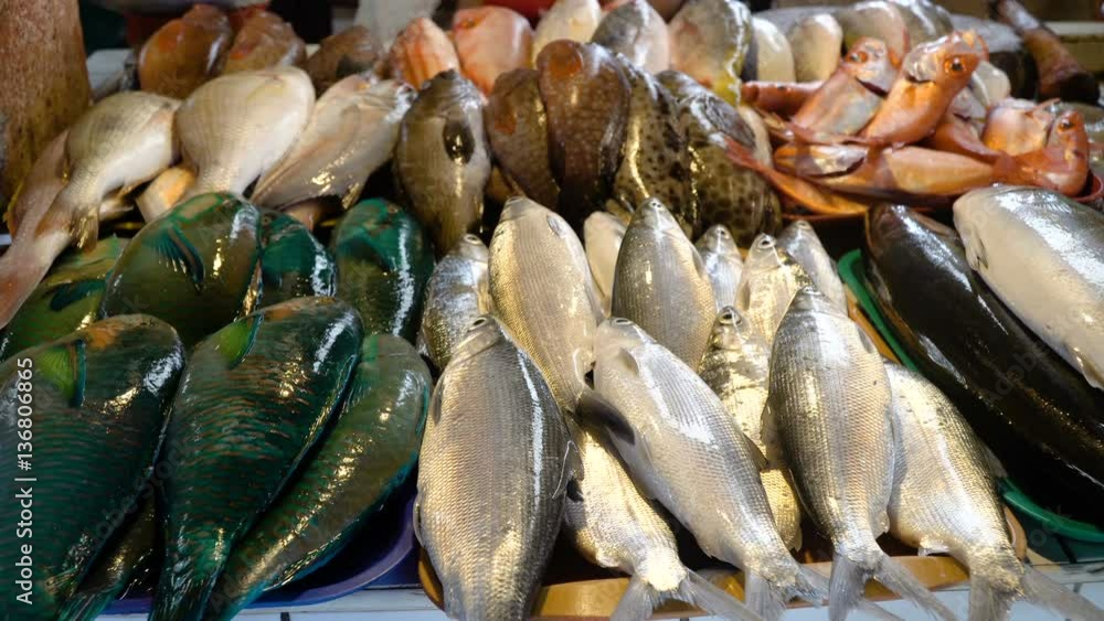 Fresh fish in Asian market. Sale of fresh sea fish in the Asian public ...