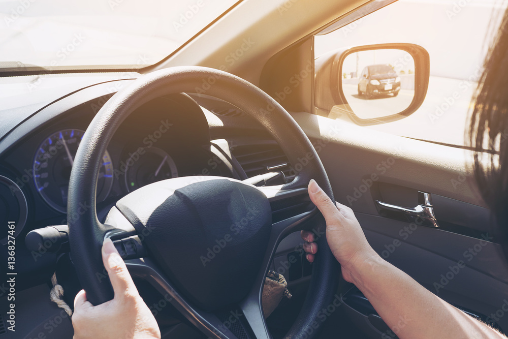 Woman driving car using two hand Stock Photo | Adobe Stock