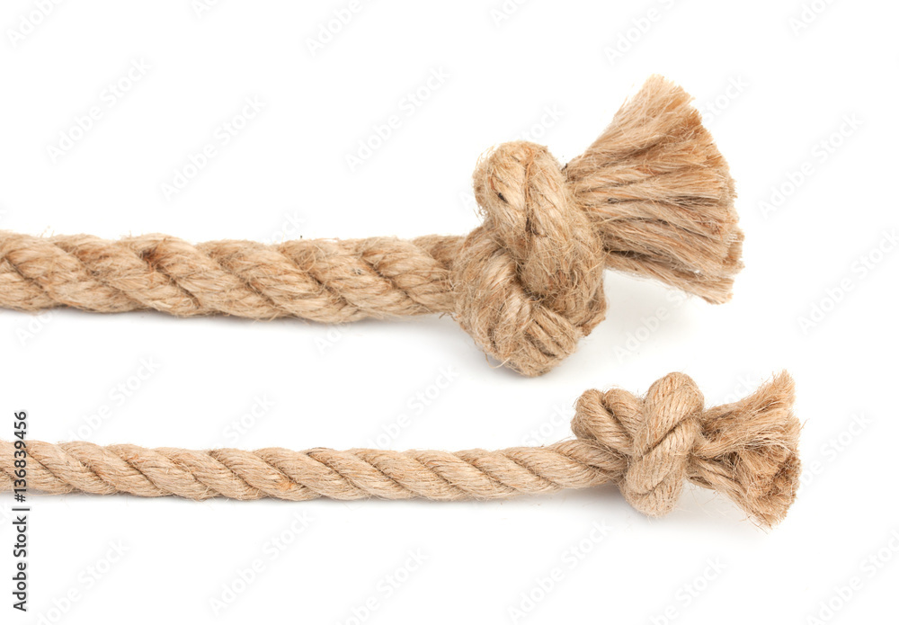 Pair of ropes are different diameters with knots isolated on a w Stock ...