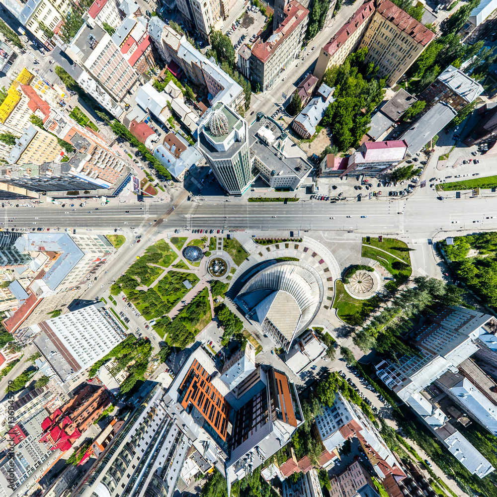 Aerial city view with crossroads, roads, houses, buildings, parks and ...