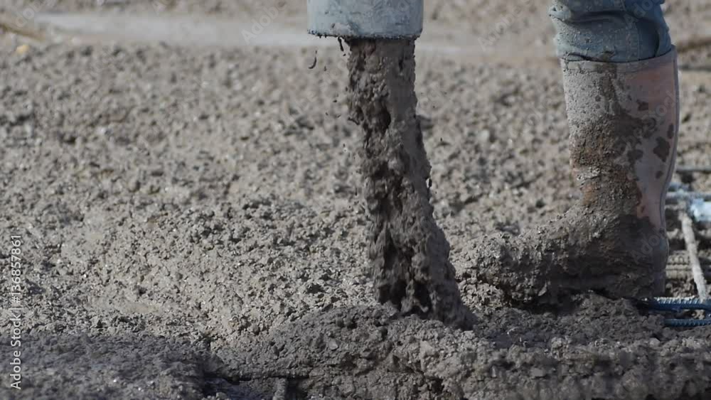 Slow Mo. Closeup. Pouring concrete mix on concreting formwork. Forming ...