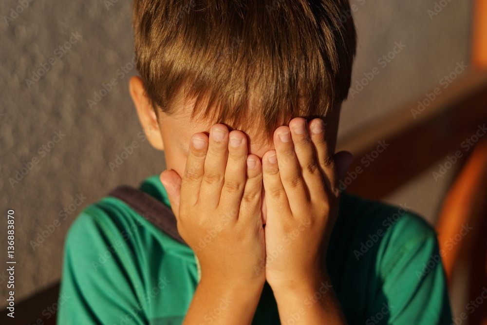 Boy Hiding His Face