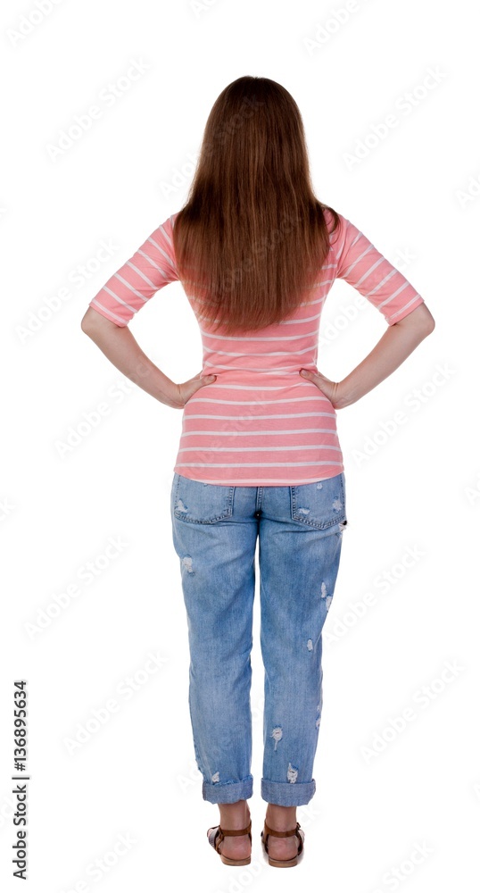 back view of standing young beautiful redhead woman. girl watching ...