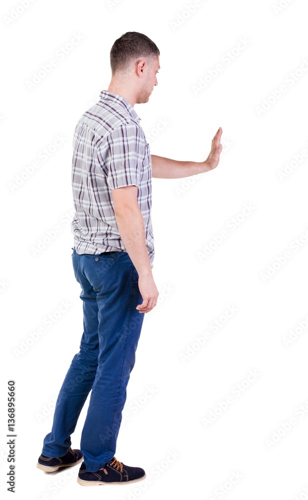back view of man. Young man jeans presses down on something. Isolated ...