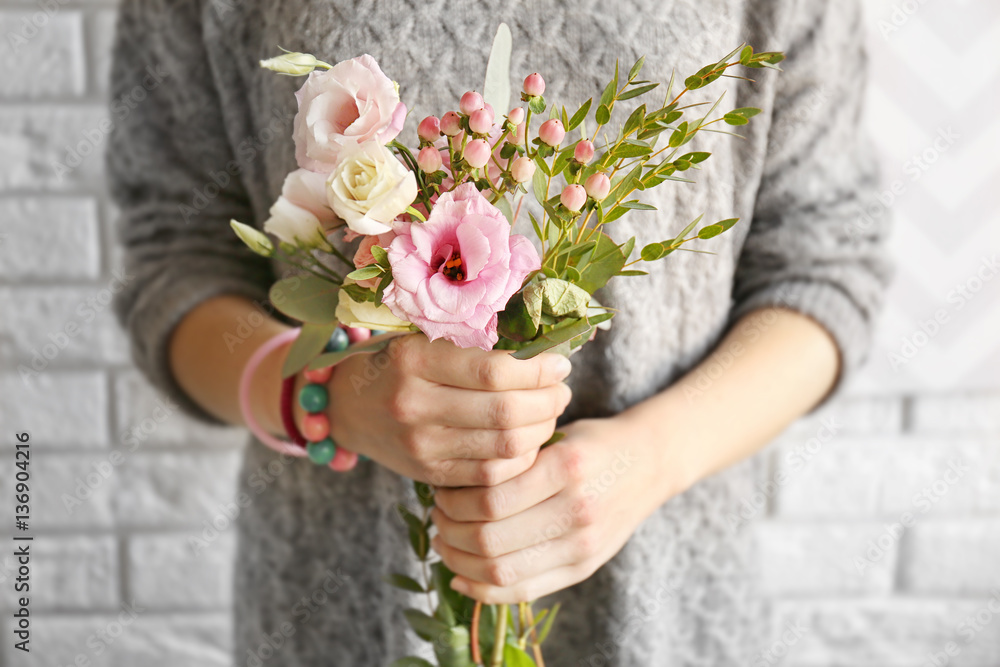 Woman holding bouquet of fresh flowers Stock Photo | Adobe Stock