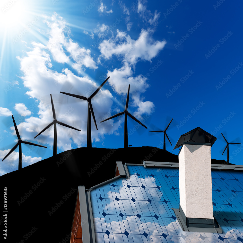 Wind and Solar Energy Concept - House roof with a solar panel and wind ...