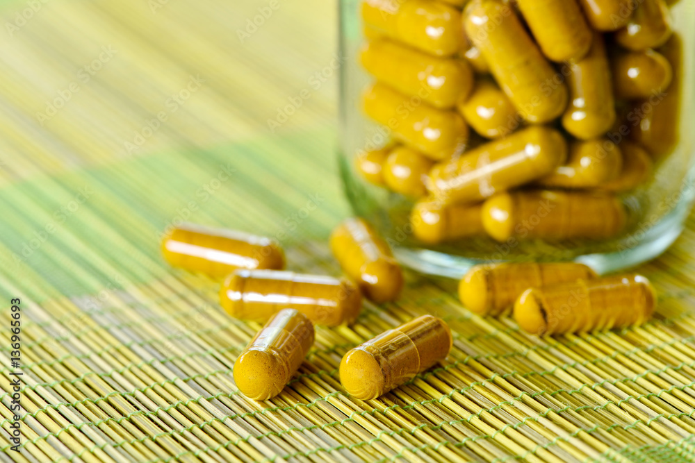 Turmeric or curcuma capsule for healthy Stock 写真 | Adobe Stock