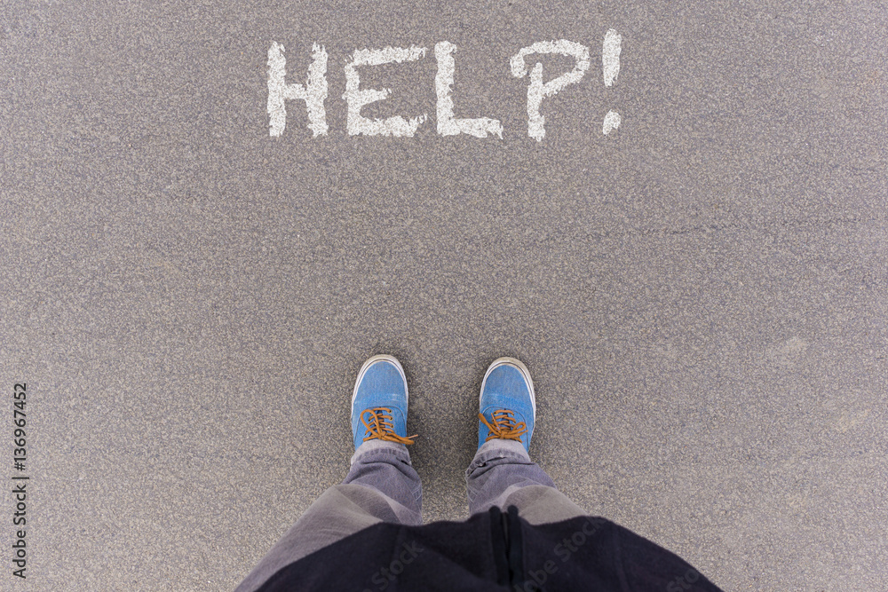 Help text on asphalt ground, feet and shoes on floor Stock Photo ...