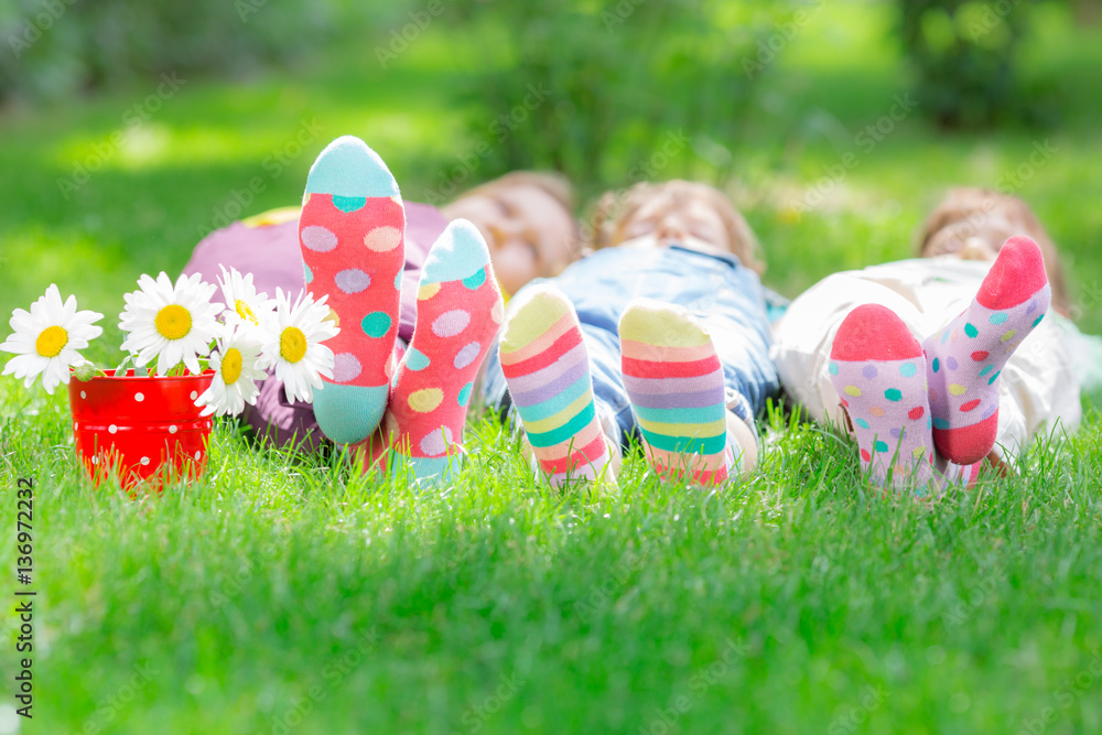Group of happy children playing outdoors Stock Photo | Adobe Stock