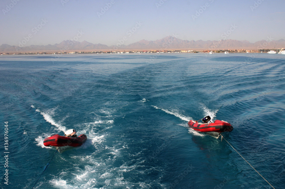 Inflatable rubber boat tied to the boat, Red Sea, Egypt Stock Photo ...